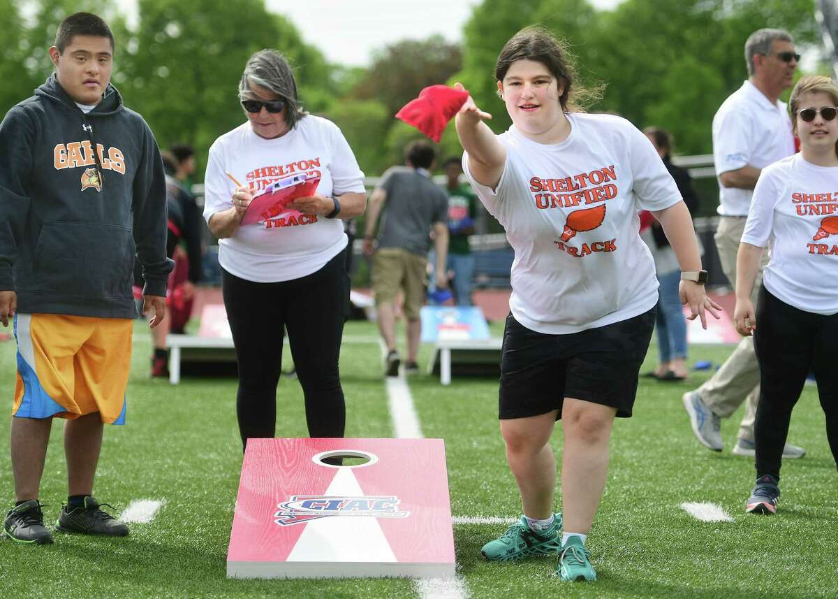 Pro wrestlers and CT students teamed up for cornhole tournament