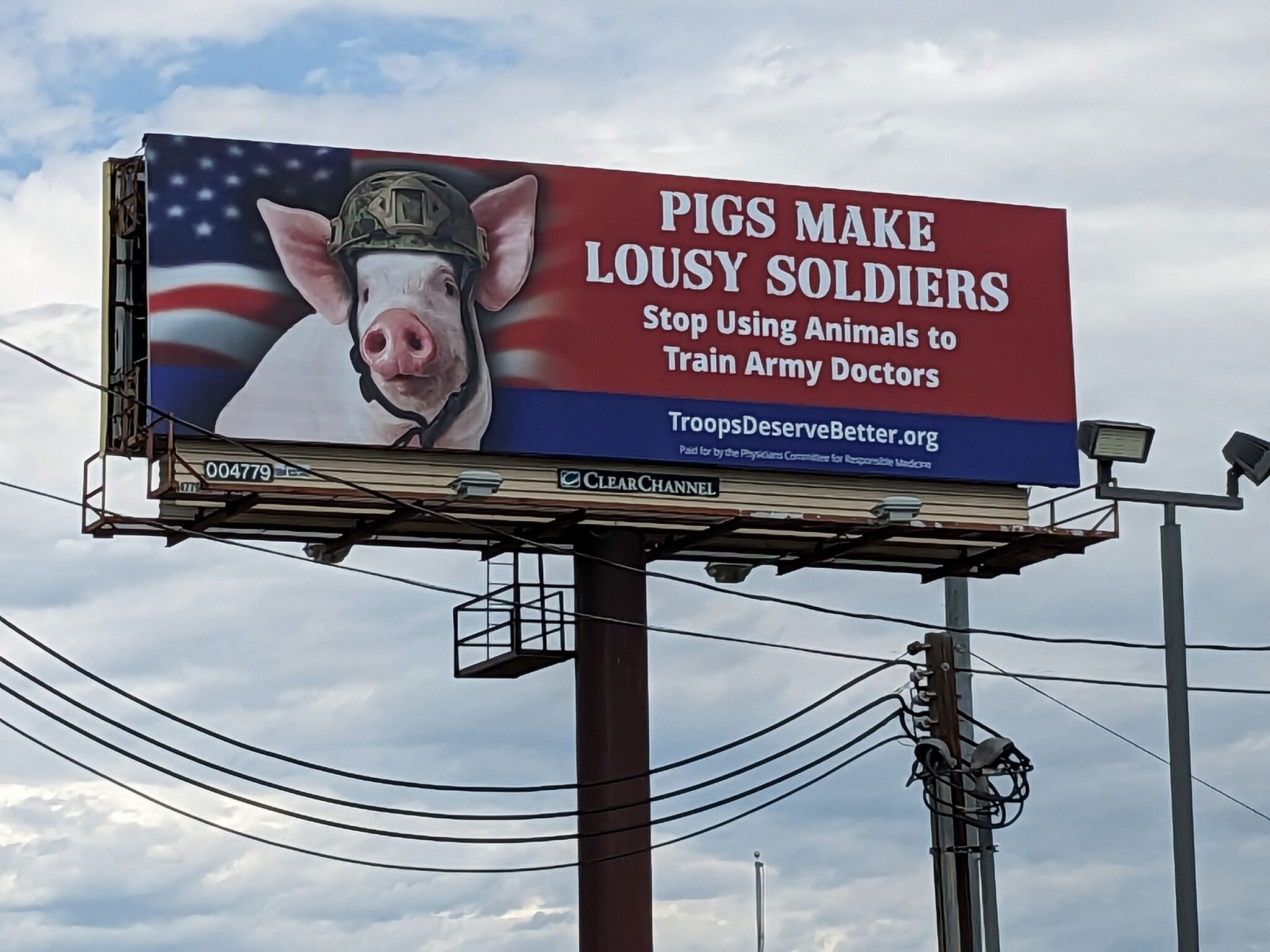 Billboards urge Brooke Army Medical Center to stop killing pigs
