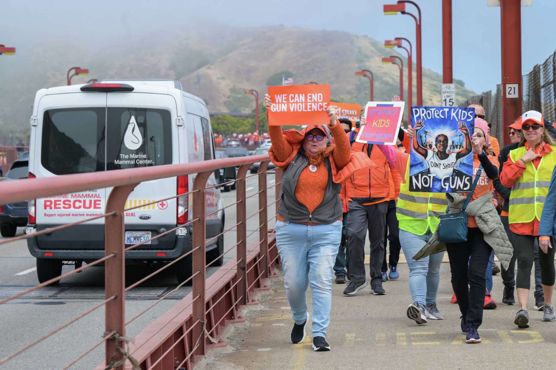 Here’s why hundreds in orange marched across Golden Gate Bridge