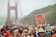 Here’s why hundreds in orange marched across Golden Gate Bridge