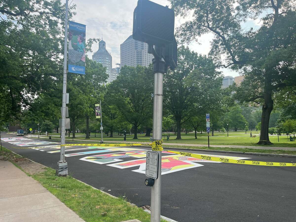 Artist covers hate symbol with heart after Hartford BLM mural defaced