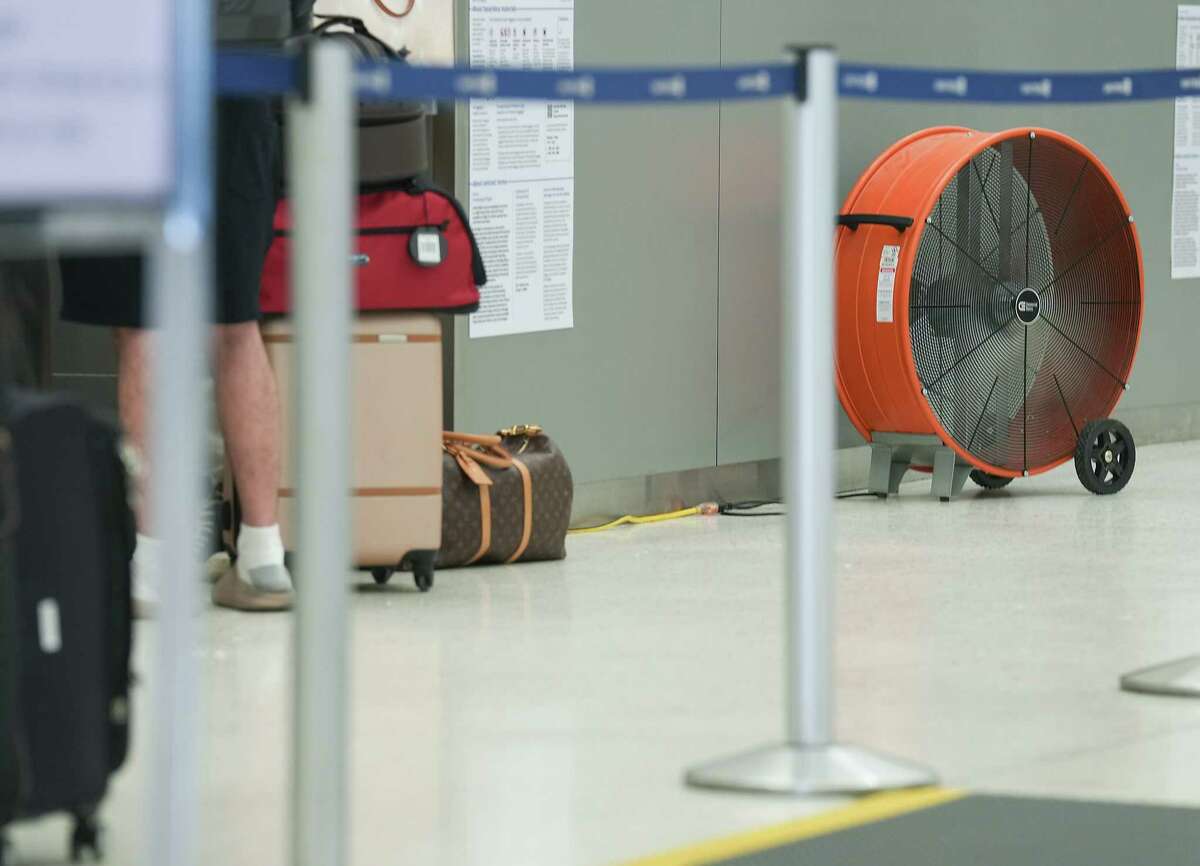 Houston airport partially restores air conditioning Tuesday