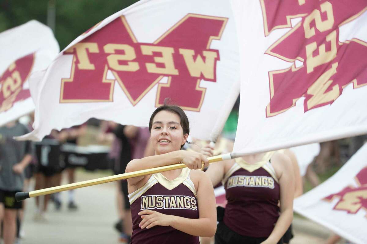 Magnolia West celebrates state championship baseball team with parade.