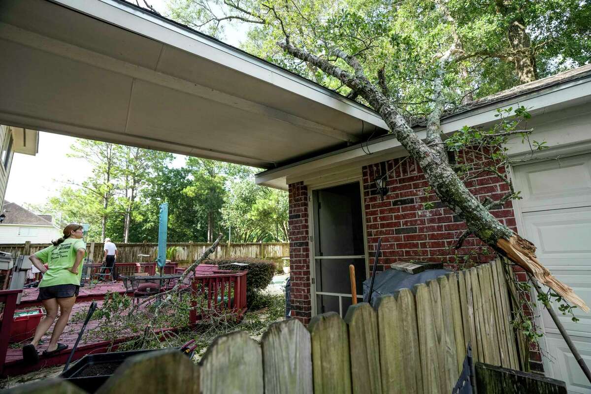 Photos of damage from Houston-area storm with hurricane-force winds