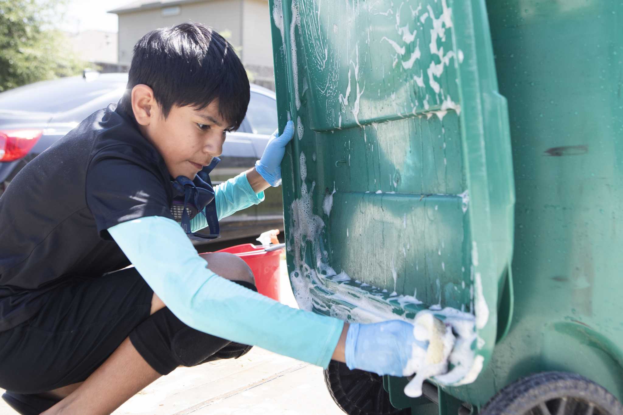 Houston's 'The Garbage Kid' grows popular New Caney trash can business