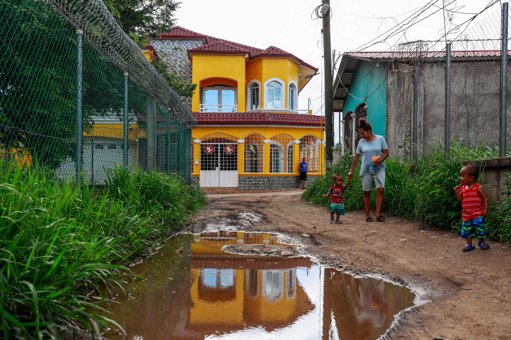 Bay Bridge murals and 49ers logos adorn this Honduran village. Why?