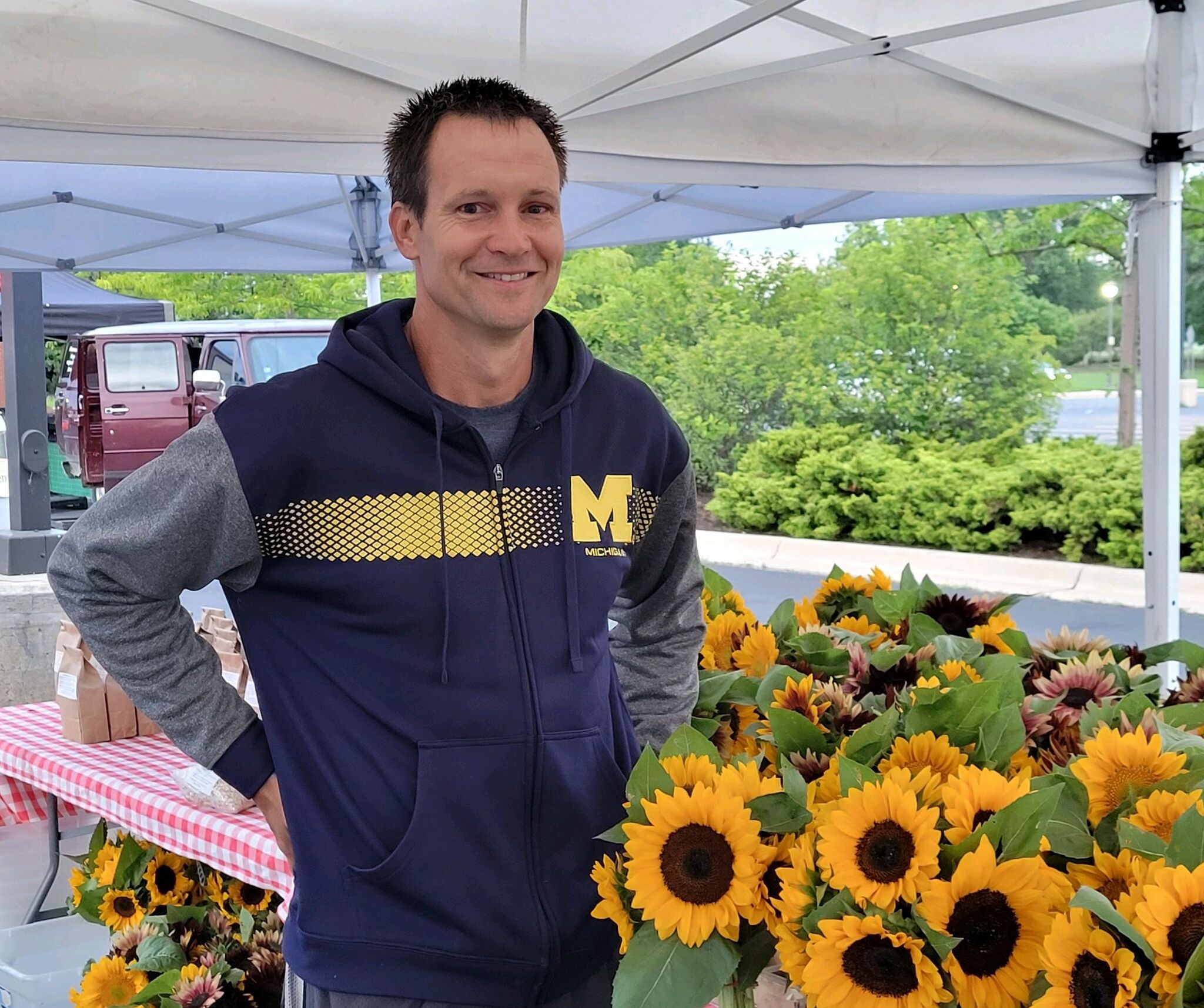 Sam Bright sells beans, peas, sunflowers, zinnias at Farmers Market
