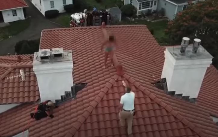 Video: Stamford first responders rescue woman from roof