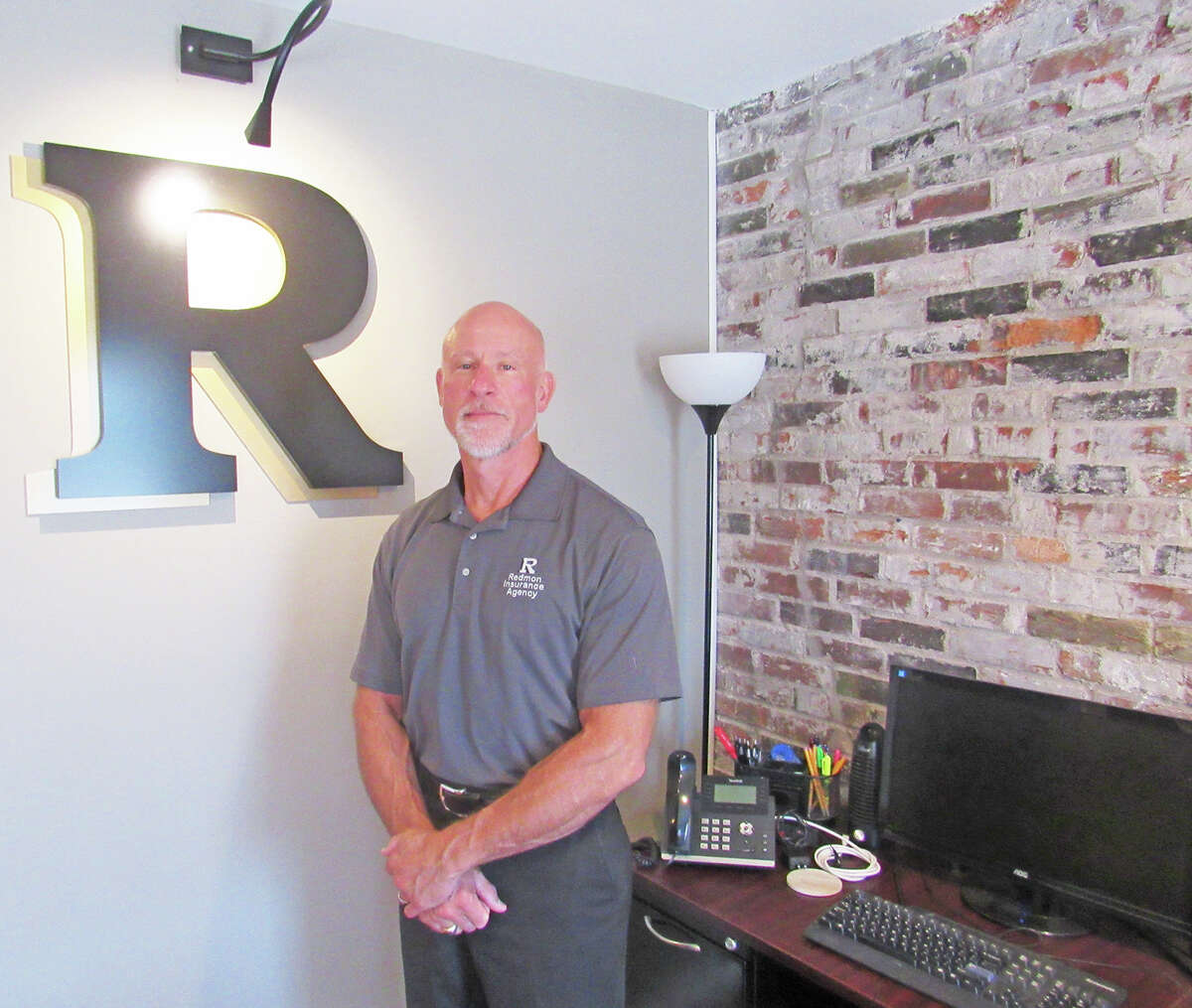 Redmon's insurance and family roots intertwine in community
