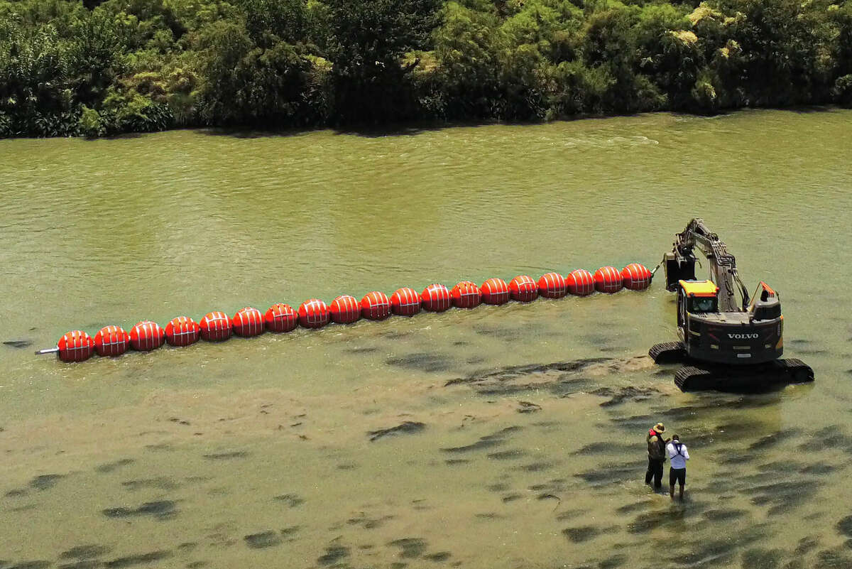 DOJ says it will sue Greg Abbott over buoy barrier in Rio Grande