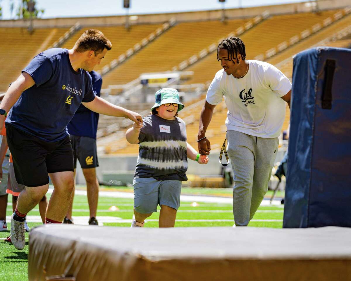 Cal players open doors to football for kids often left on the sideline