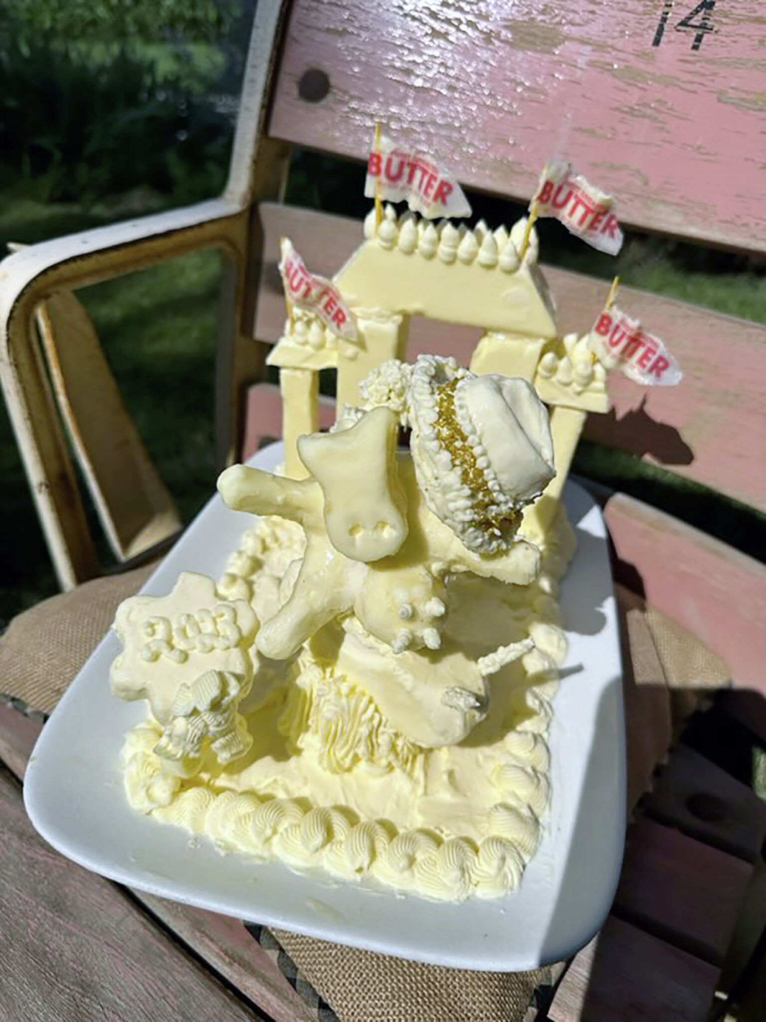 Bull-riding butter mini-cow slathered in Martin's hopes for four-peat