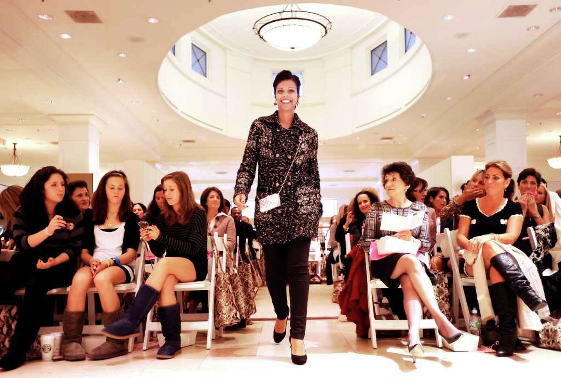 Local women model fashions for cancer charity