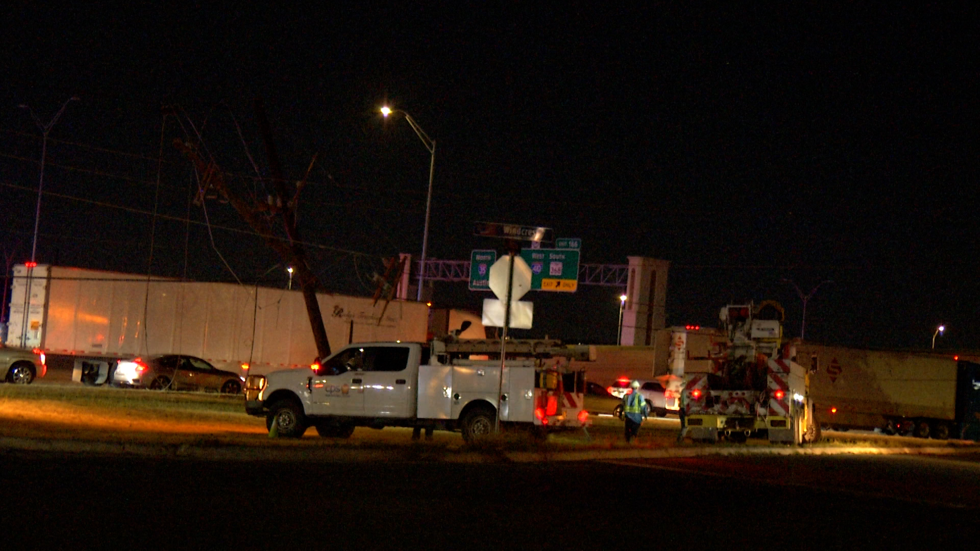 18-wheeler collides with downed lines, motorcyclist crashes nearby