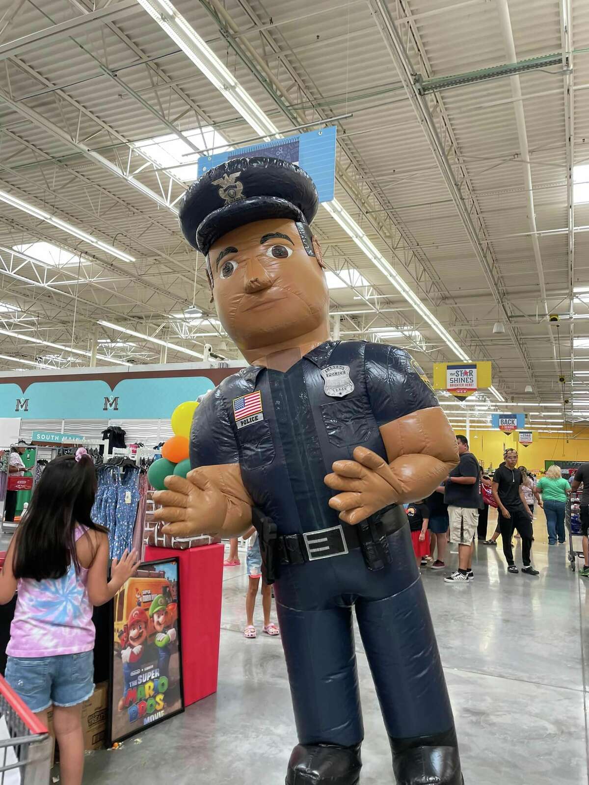 Children meet law enforcement mascots at H-E-B Kid's Day!