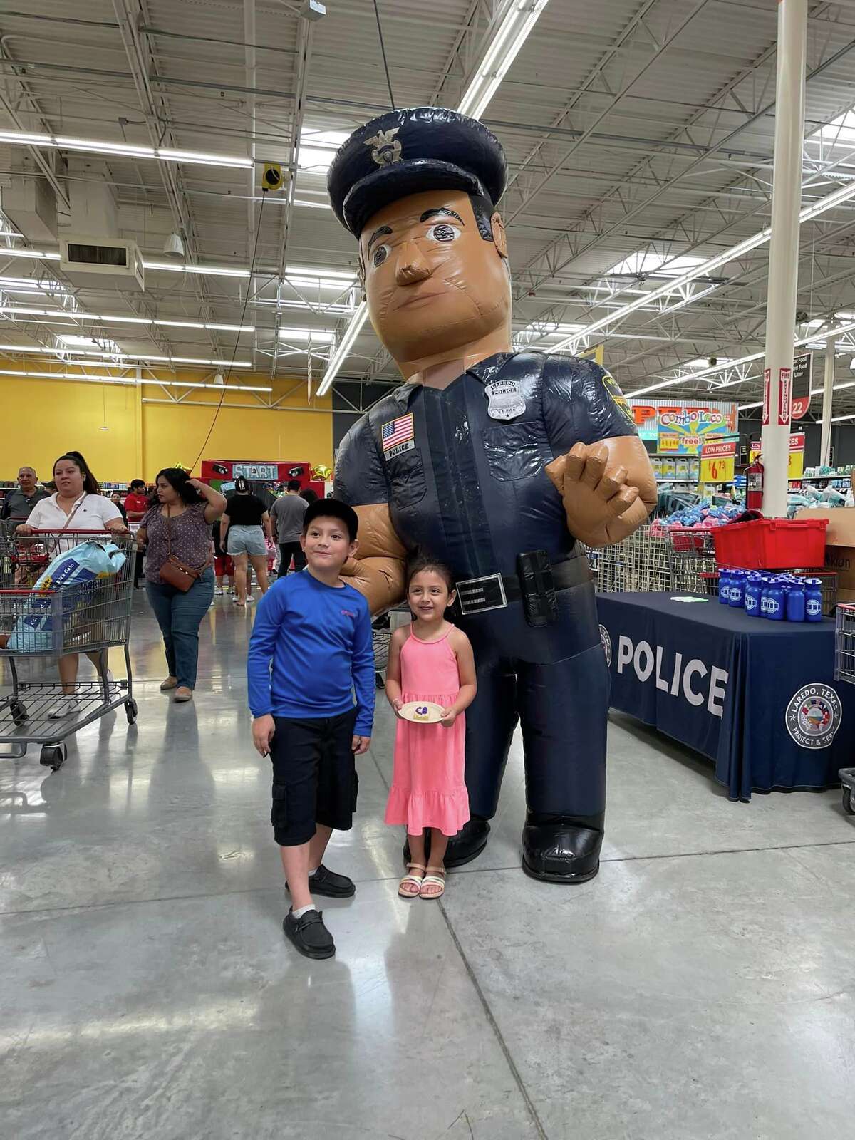 Children meet law enforcement mascots at H-E-B Kid's Day!