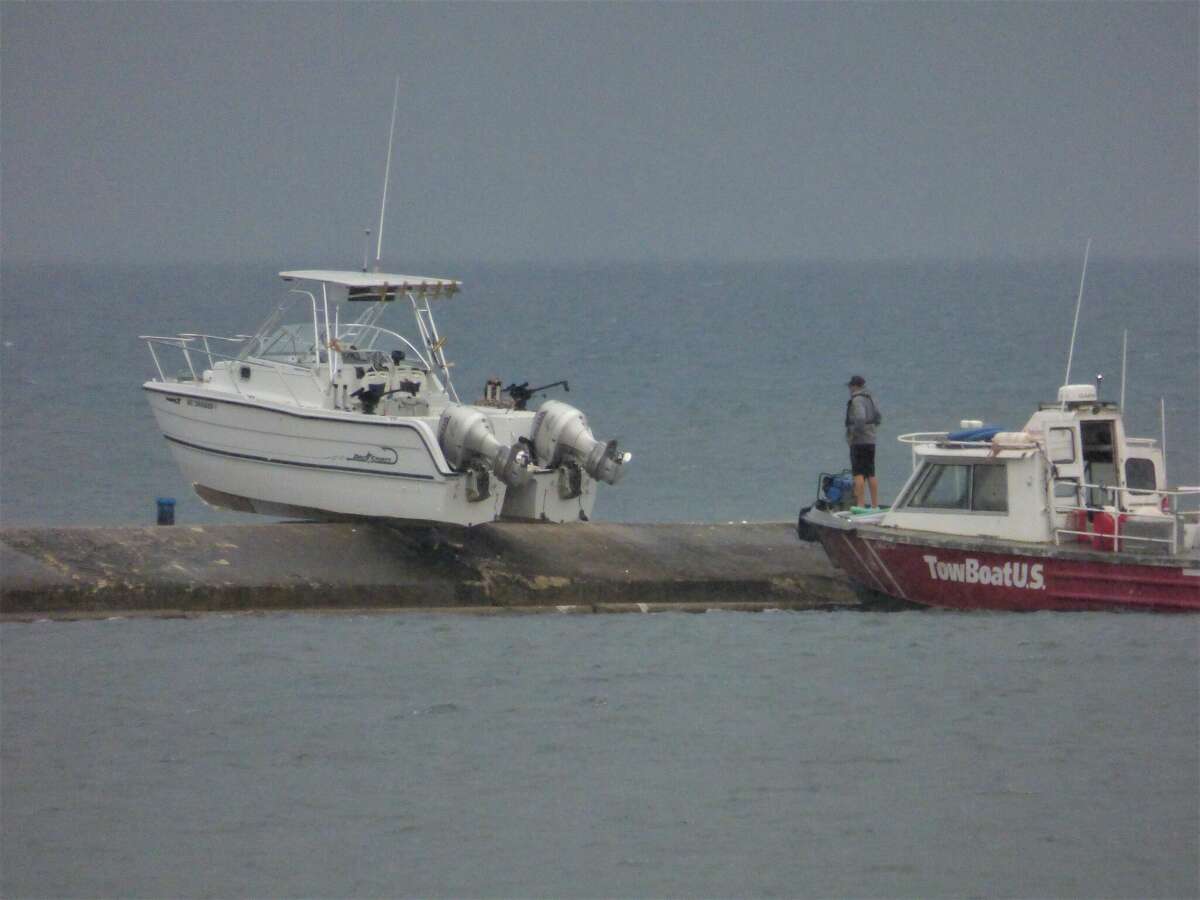 Lake Michigan pier has boat perched atop after early morning crash