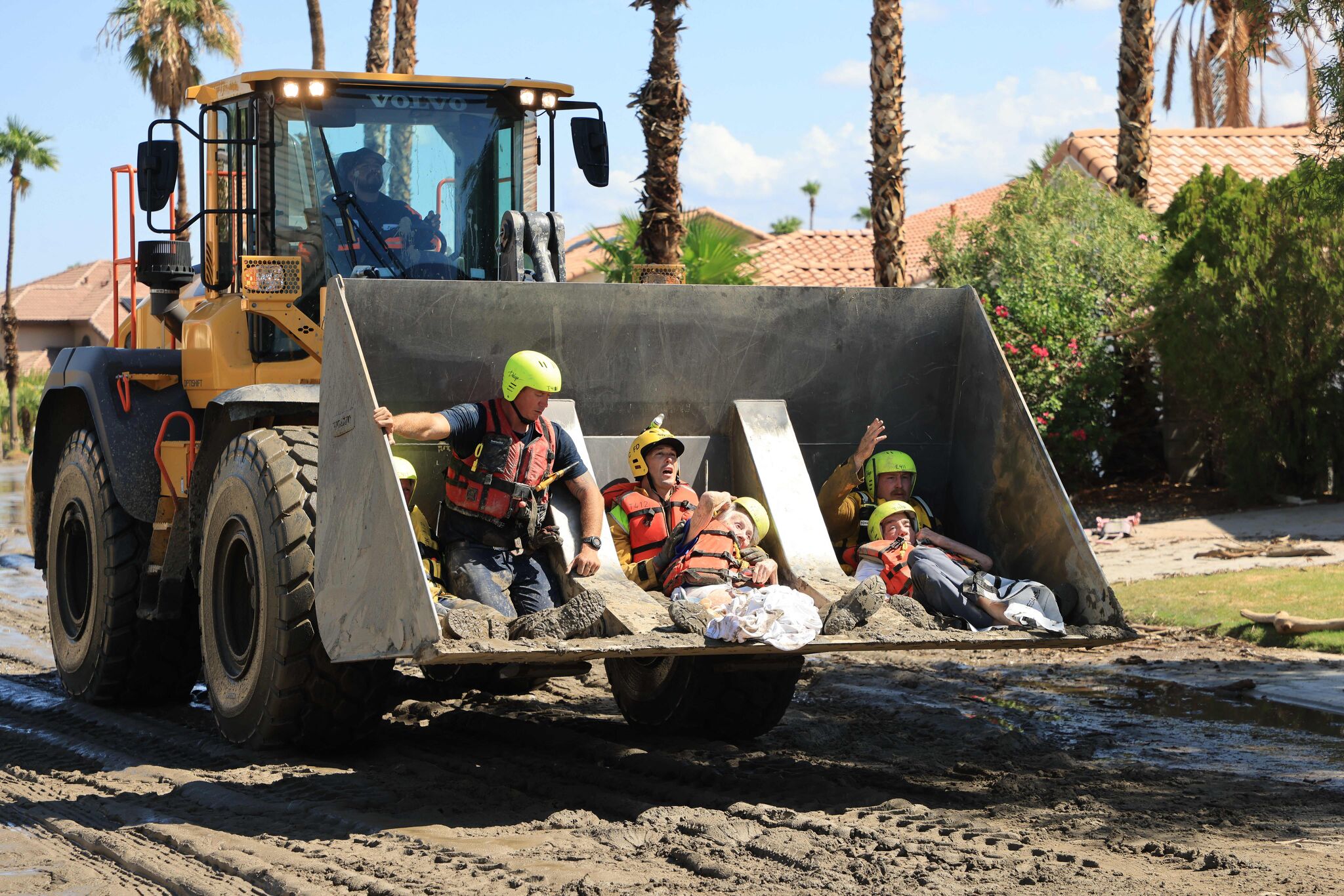 Bulldozer carries 14 people out of California mudslide