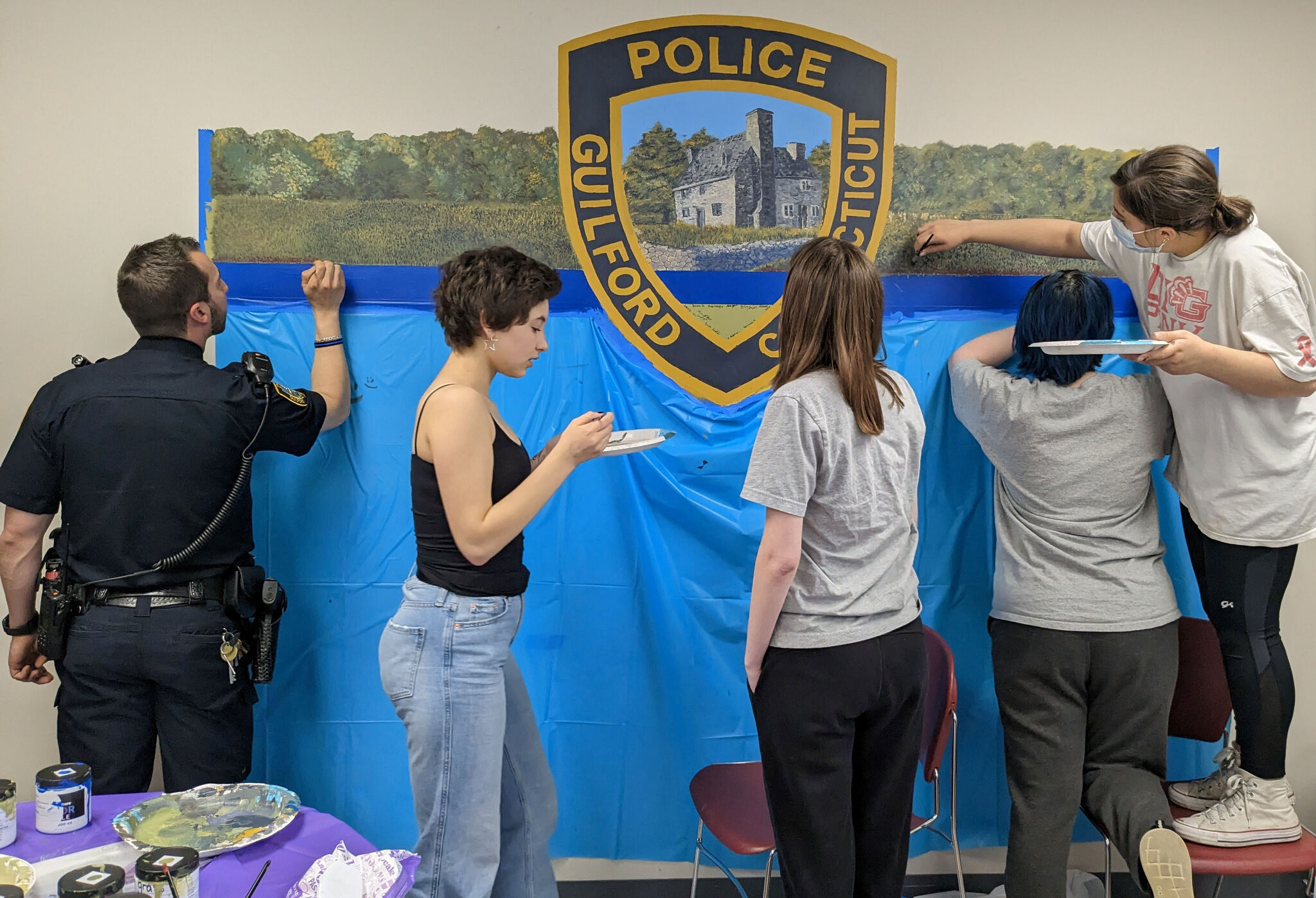 GHS students brighten up Guilford Police break room with mural