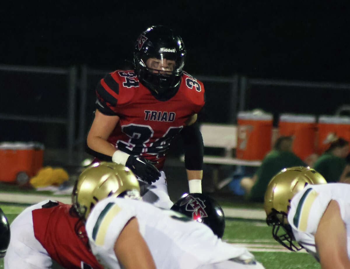 Qualls, Ackerman combine for seven touchdowns in Triad’s rout