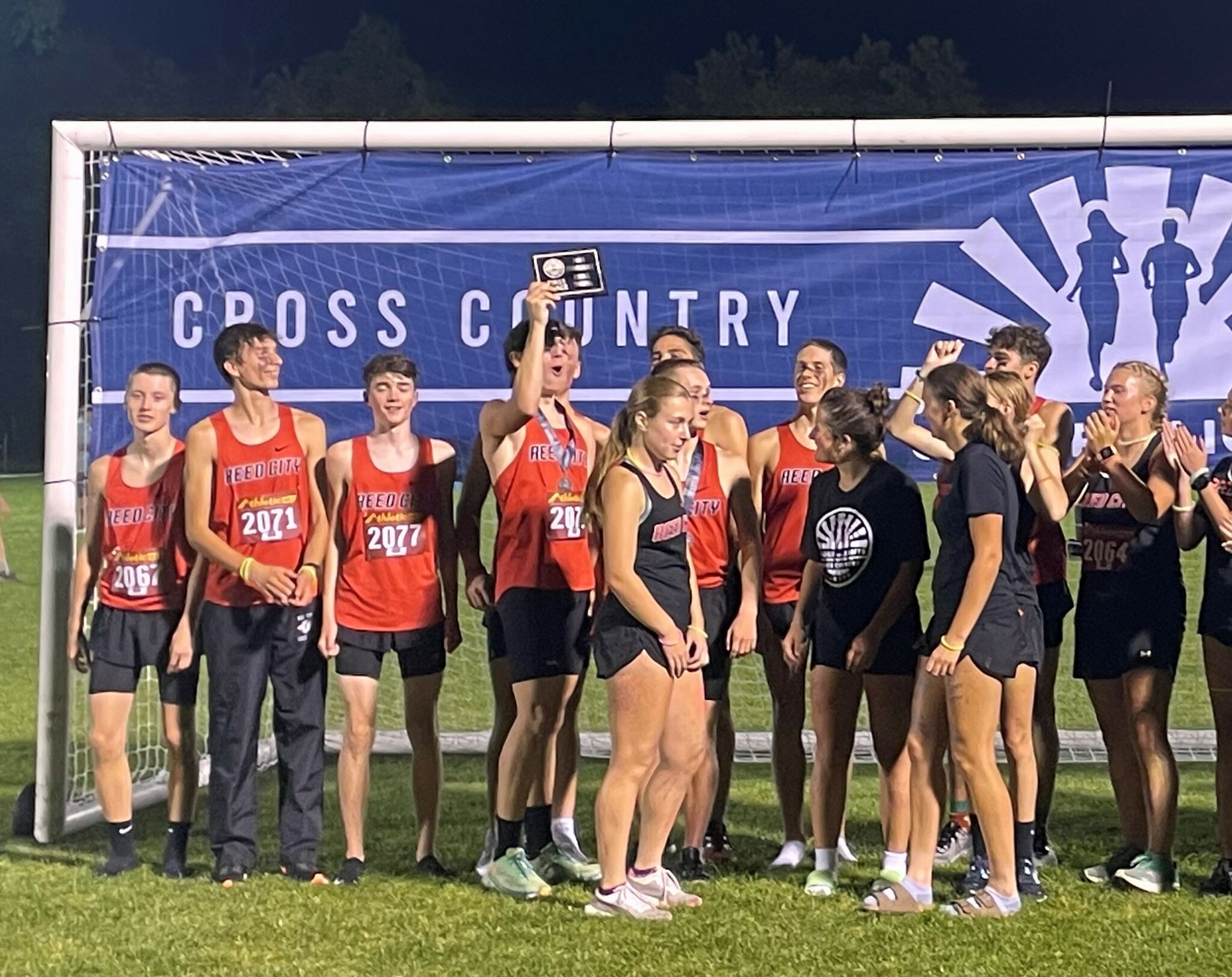 Turn on the lights: Reed City boy runners are invitational champions