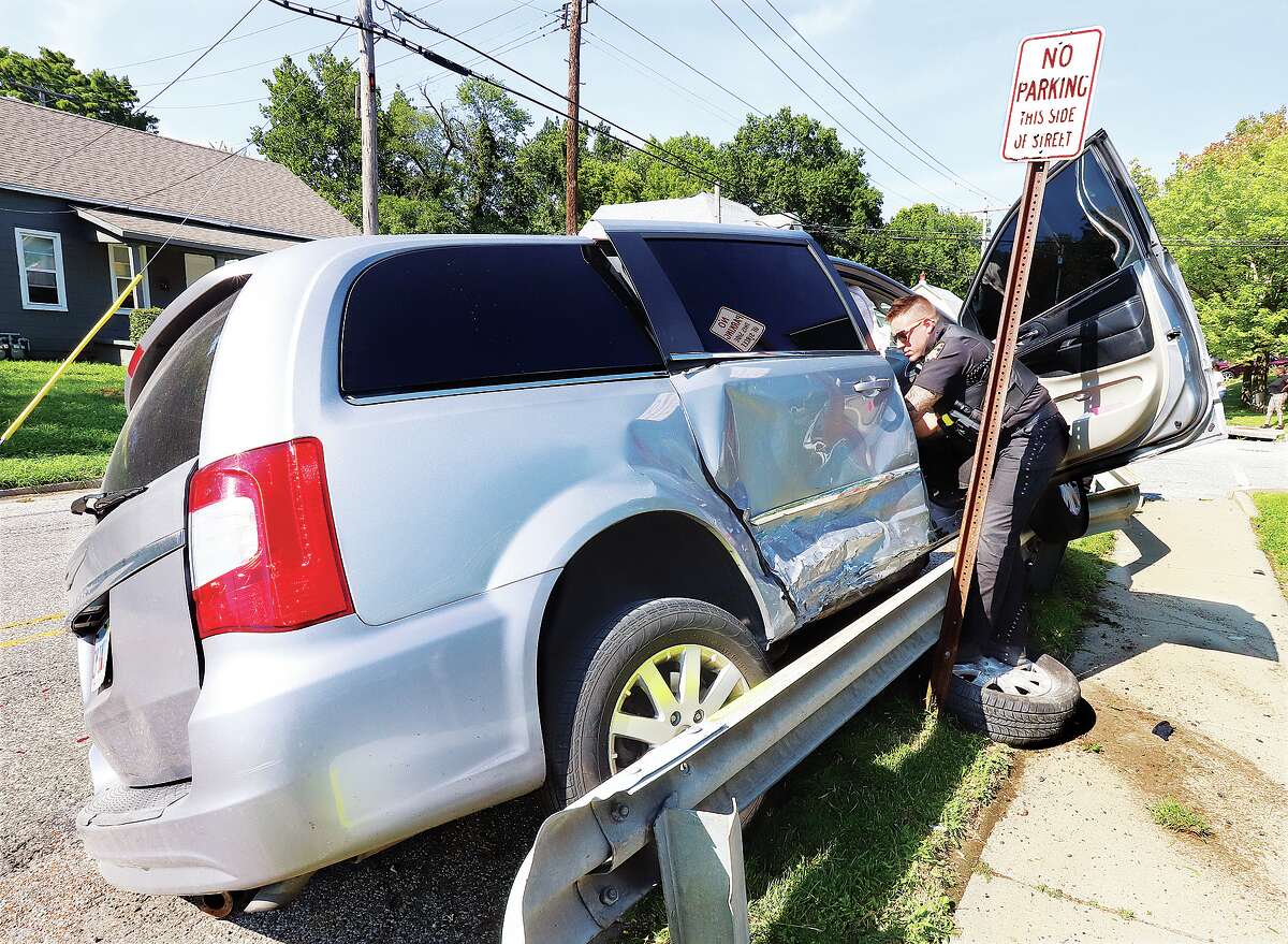 Three treated after mini-vans collide in Alton