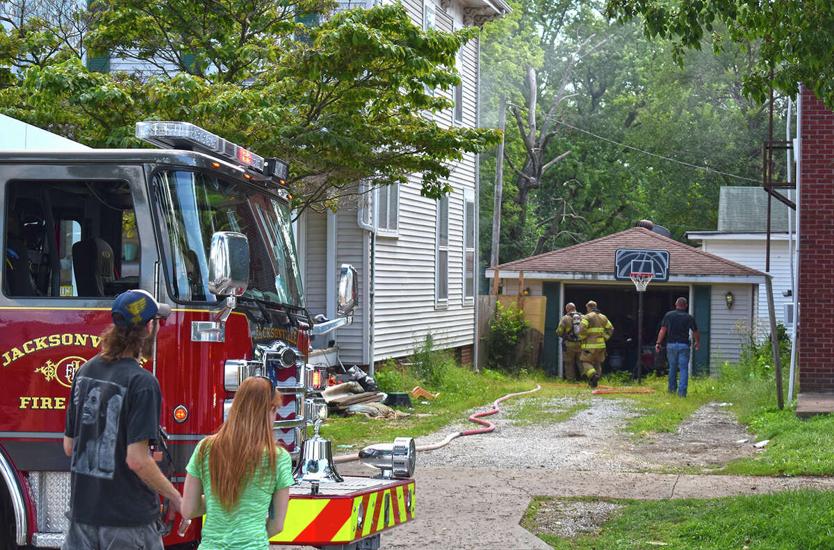 Firefighters Putting Out House Fire