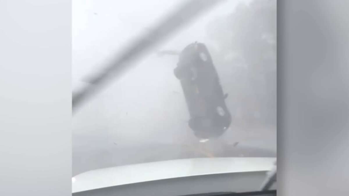Video: Powerful winds, possible tornado throw car into the air