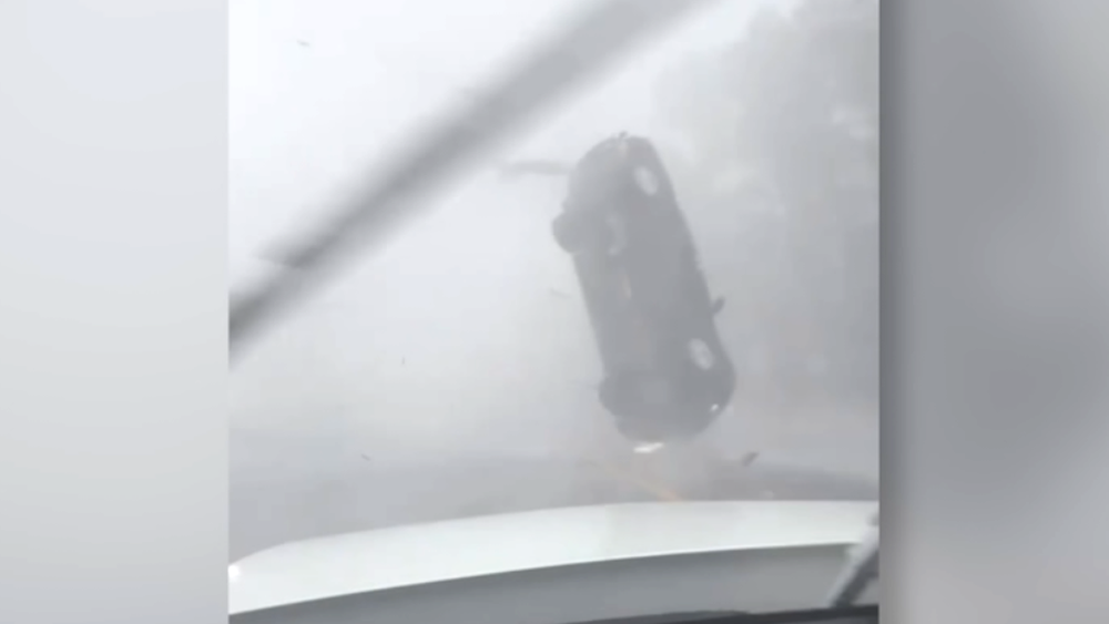 Video: Powerful winds, possible tornado throw car into the air