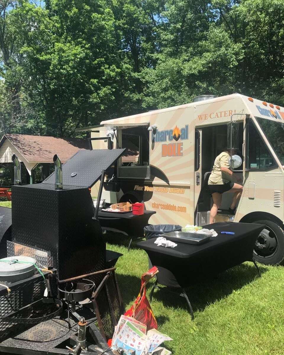 Charcoal Dole food truck owner Paul Dolan dishes barbecue, catering