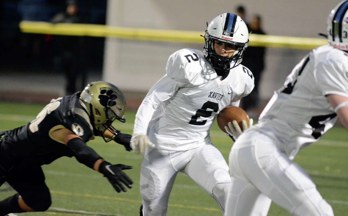 Hand (CT) High School football defeats Xavier in SCC action.