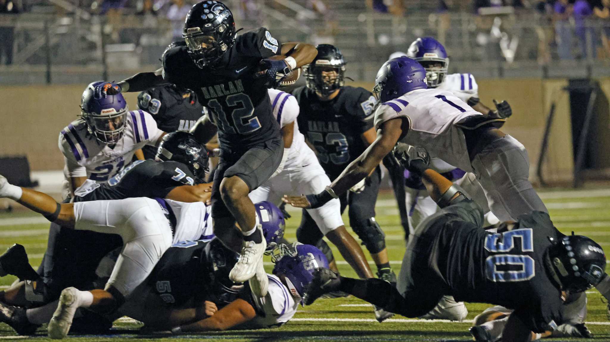 Harlan football races past Warren for 29-6A victory