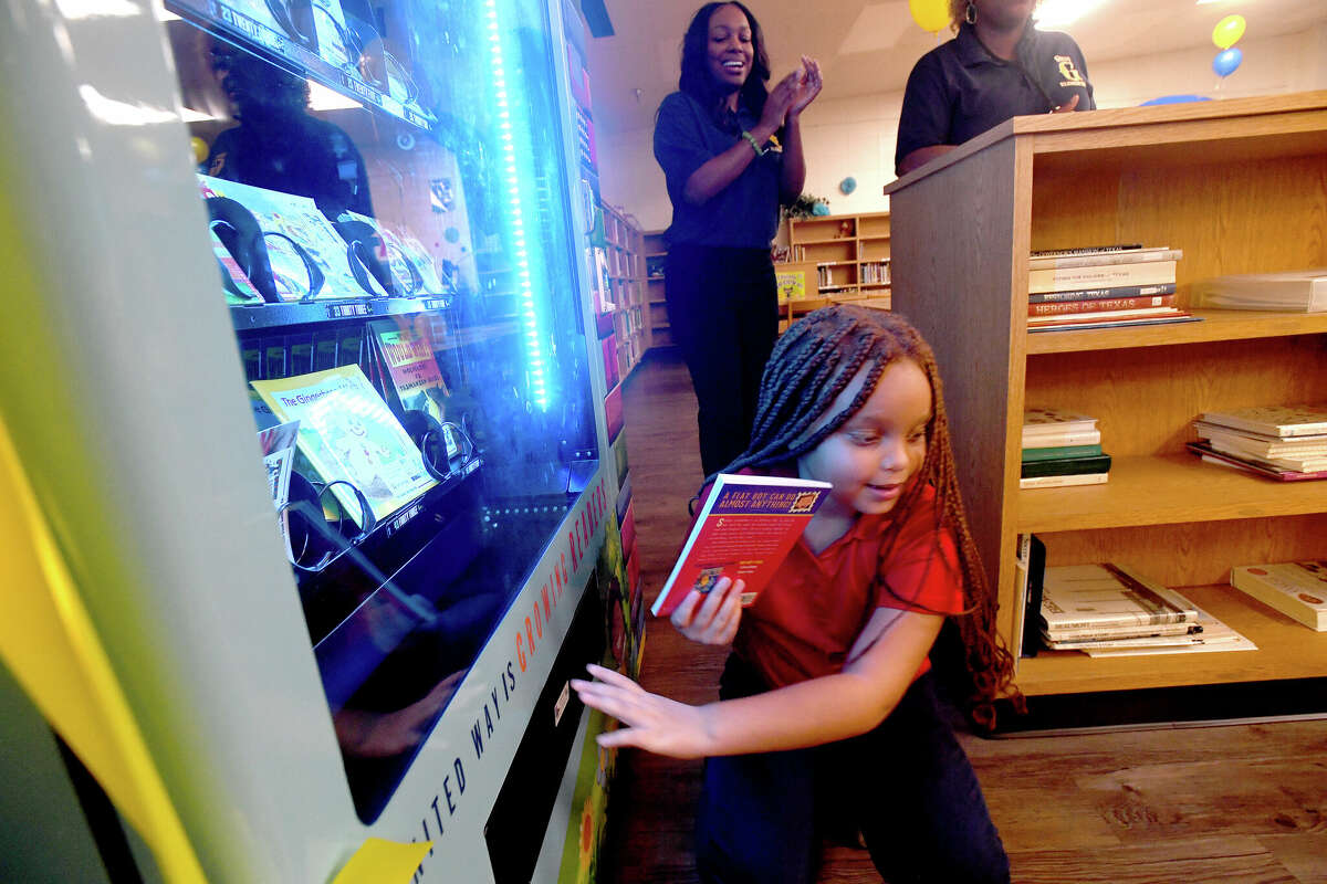 Entergy powers up United Way book vending machine initiative