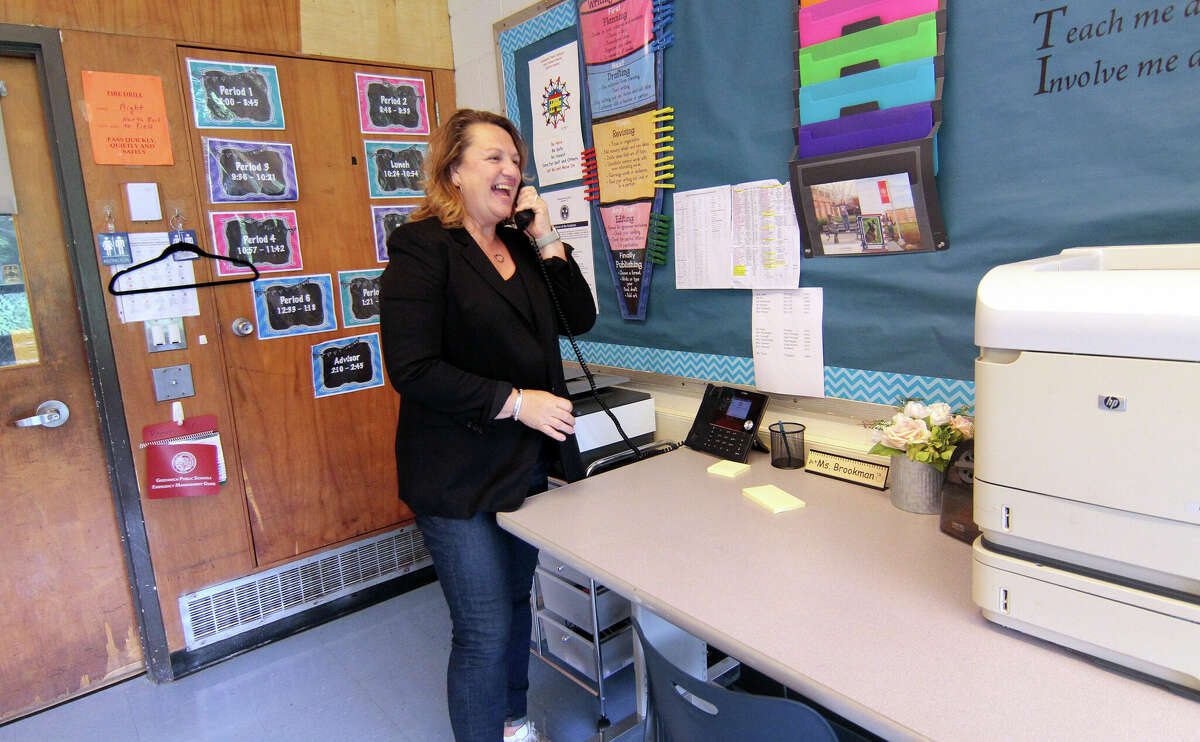 Greenwich woman 'happiest human' teaching with her adult kids