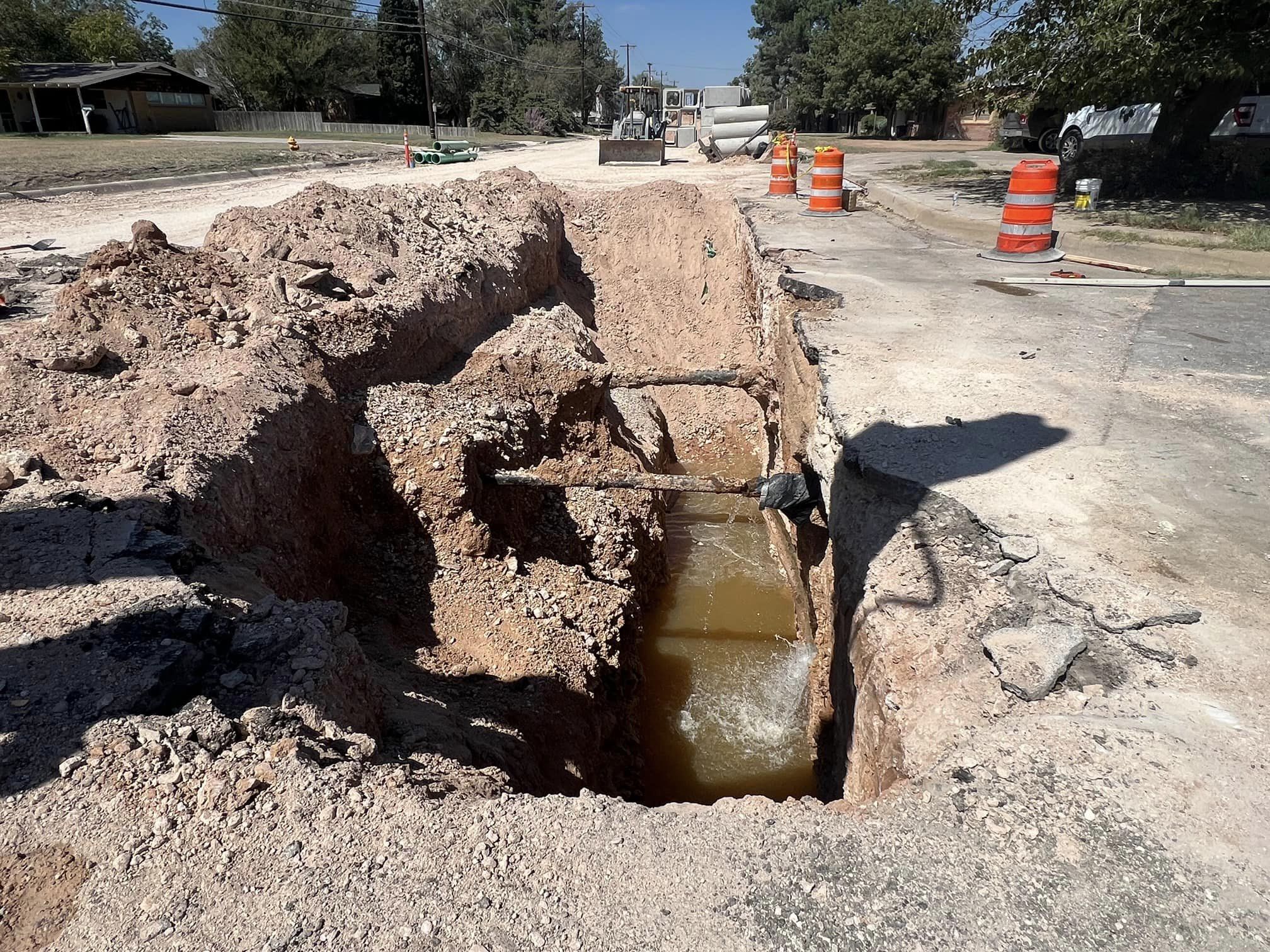 Crews repairing two water main breaks in central Midland
