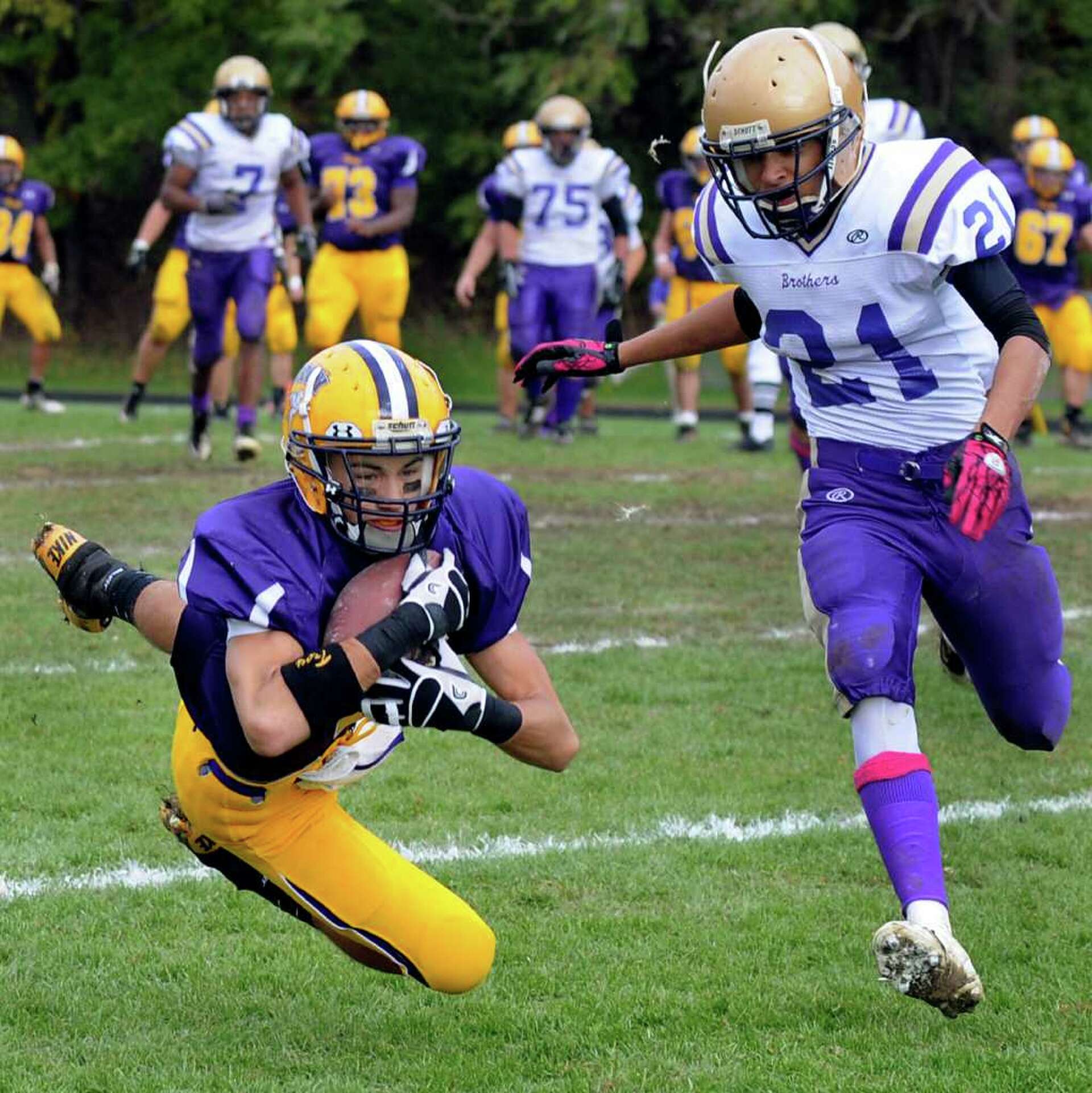 Troy sputters, but advances