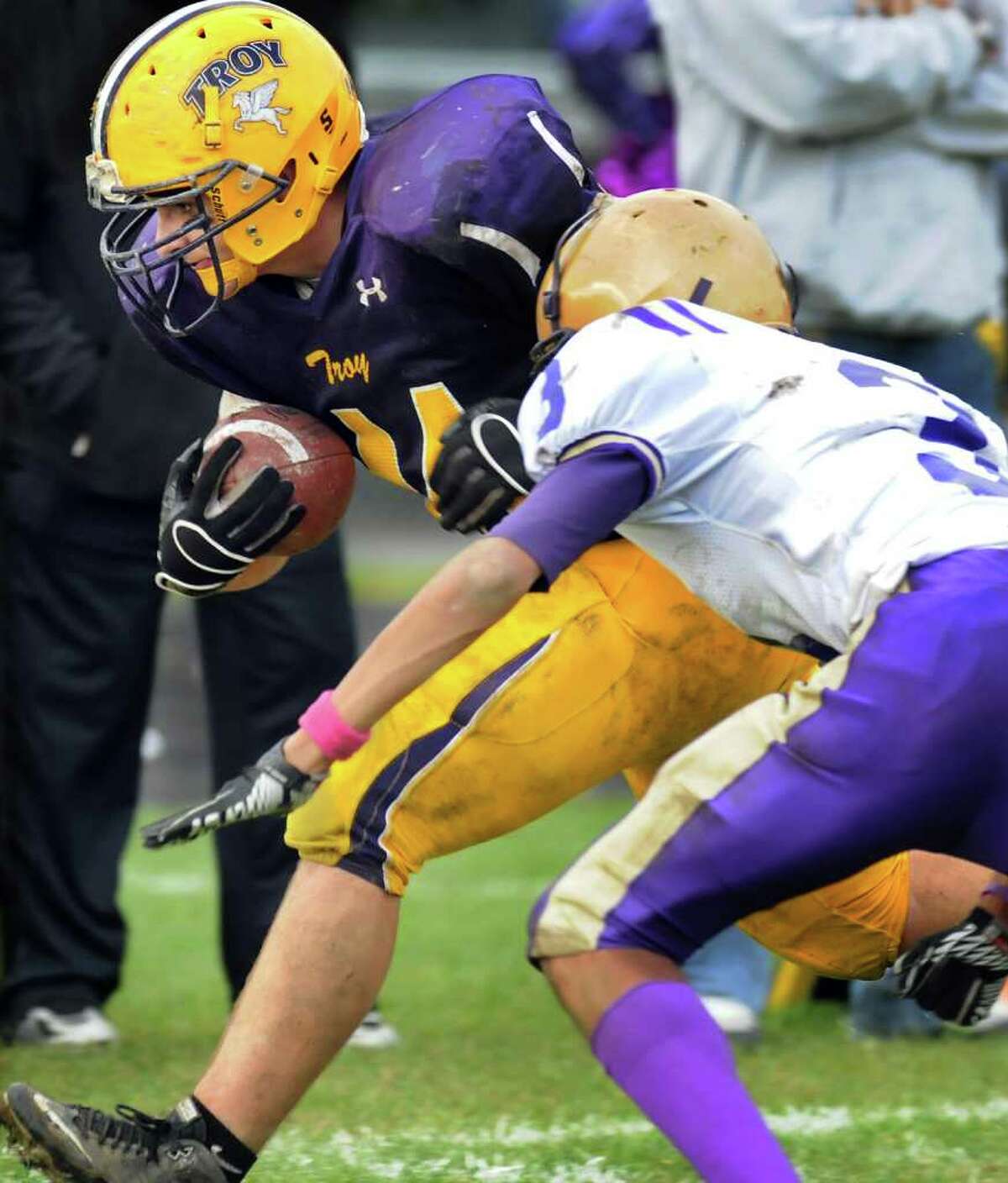 Troy sputters, but advances