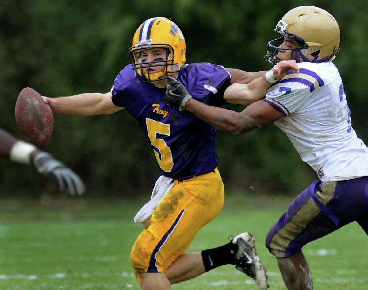 Troy sputters, but advances