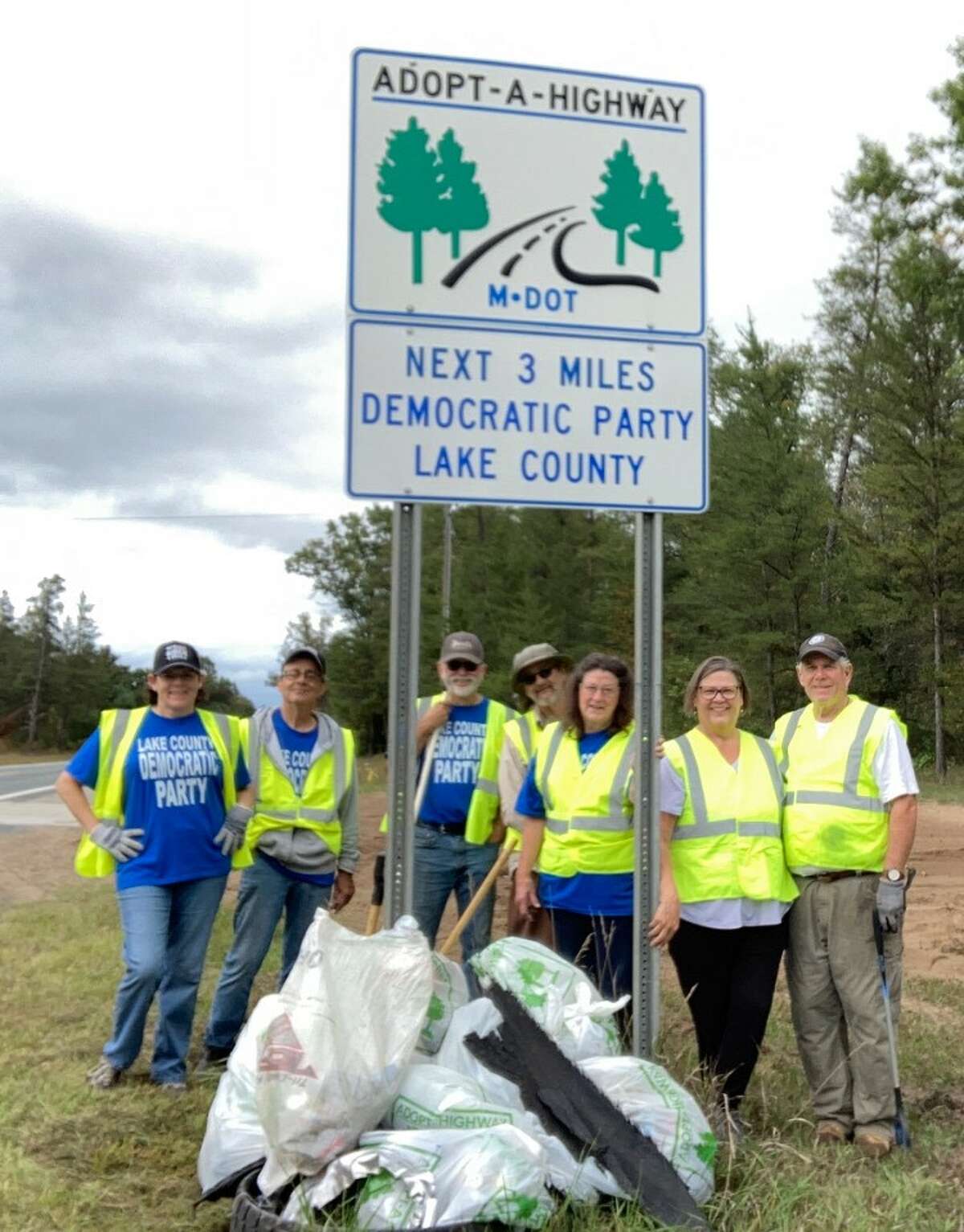 Volunteers clean up a 3-mile section of M-37 in Baldwin