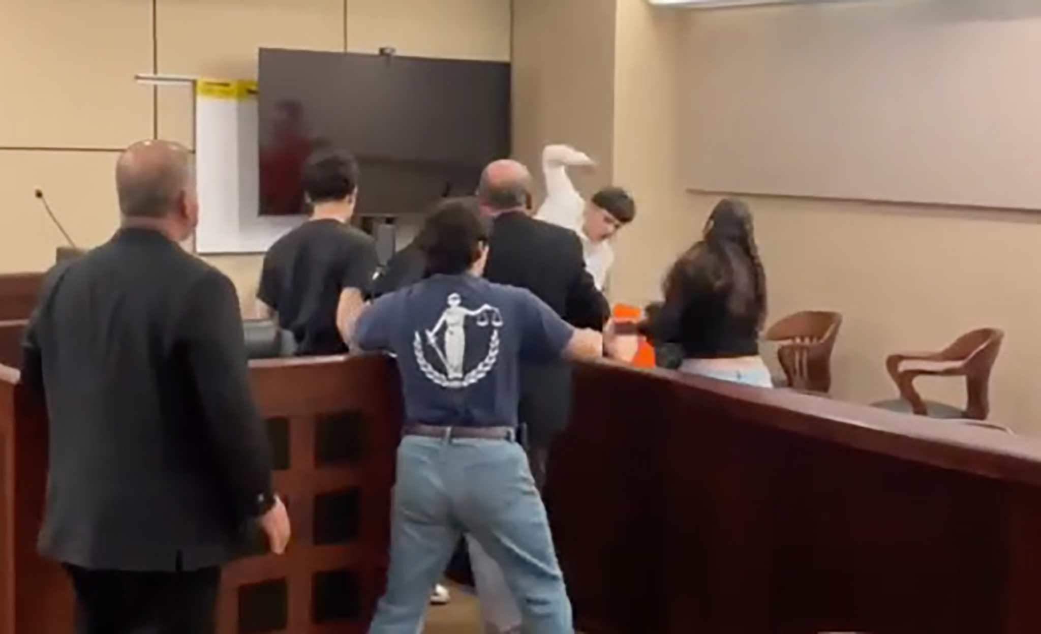 Family members attack murder defendant in Texas courtroom