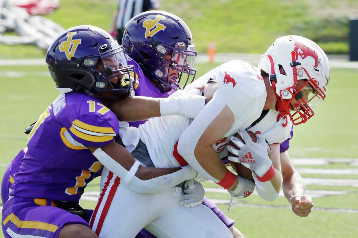 HS football: Memorial dominates early to topple Jersey Village