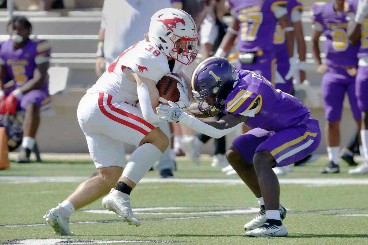 HS football: Memorial dominates early to topple Jersey Village