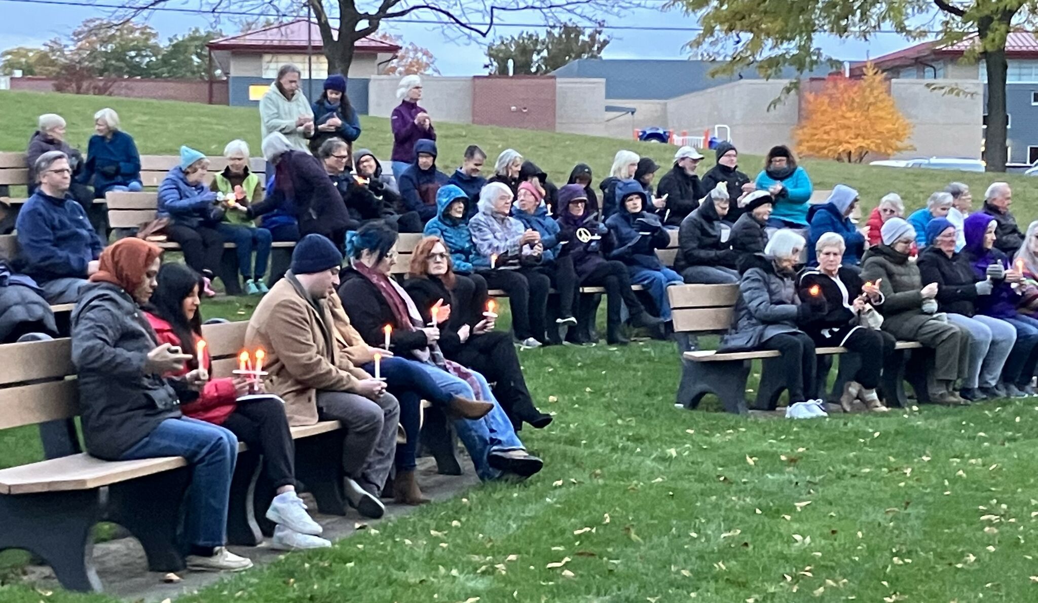 Speakers from four congregations spoke to about 100 at a peace vigil
