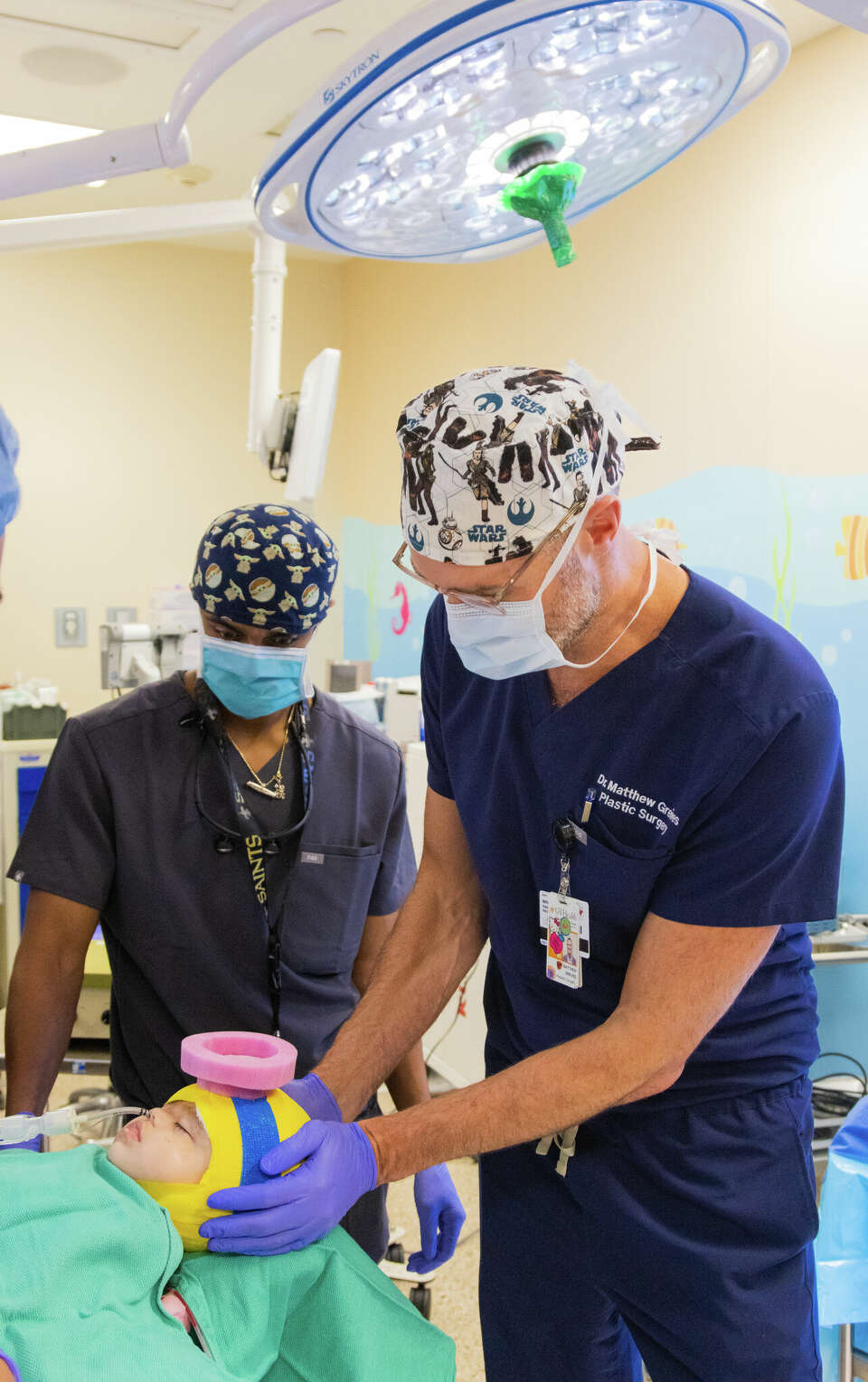 Houston pediatric surgeon creates colorful head wraps for his patients