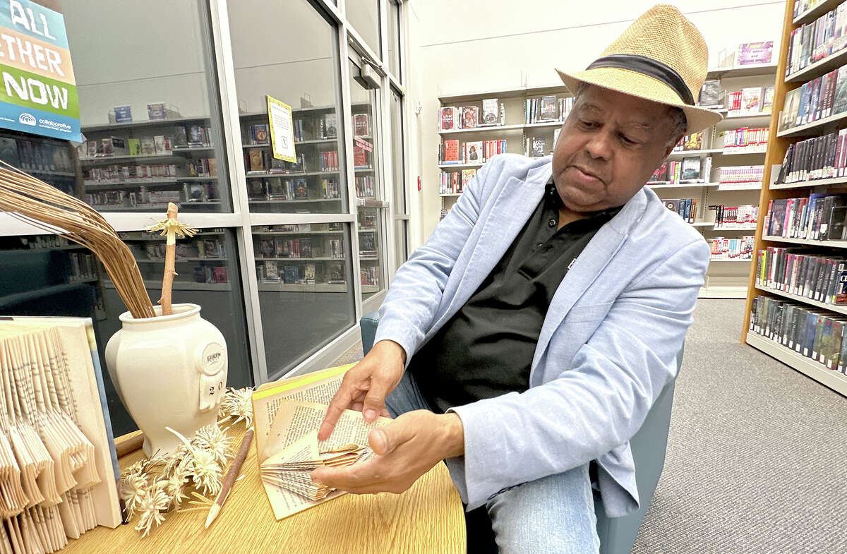 Veteran Herman Davis known for wood carvings turns to book art