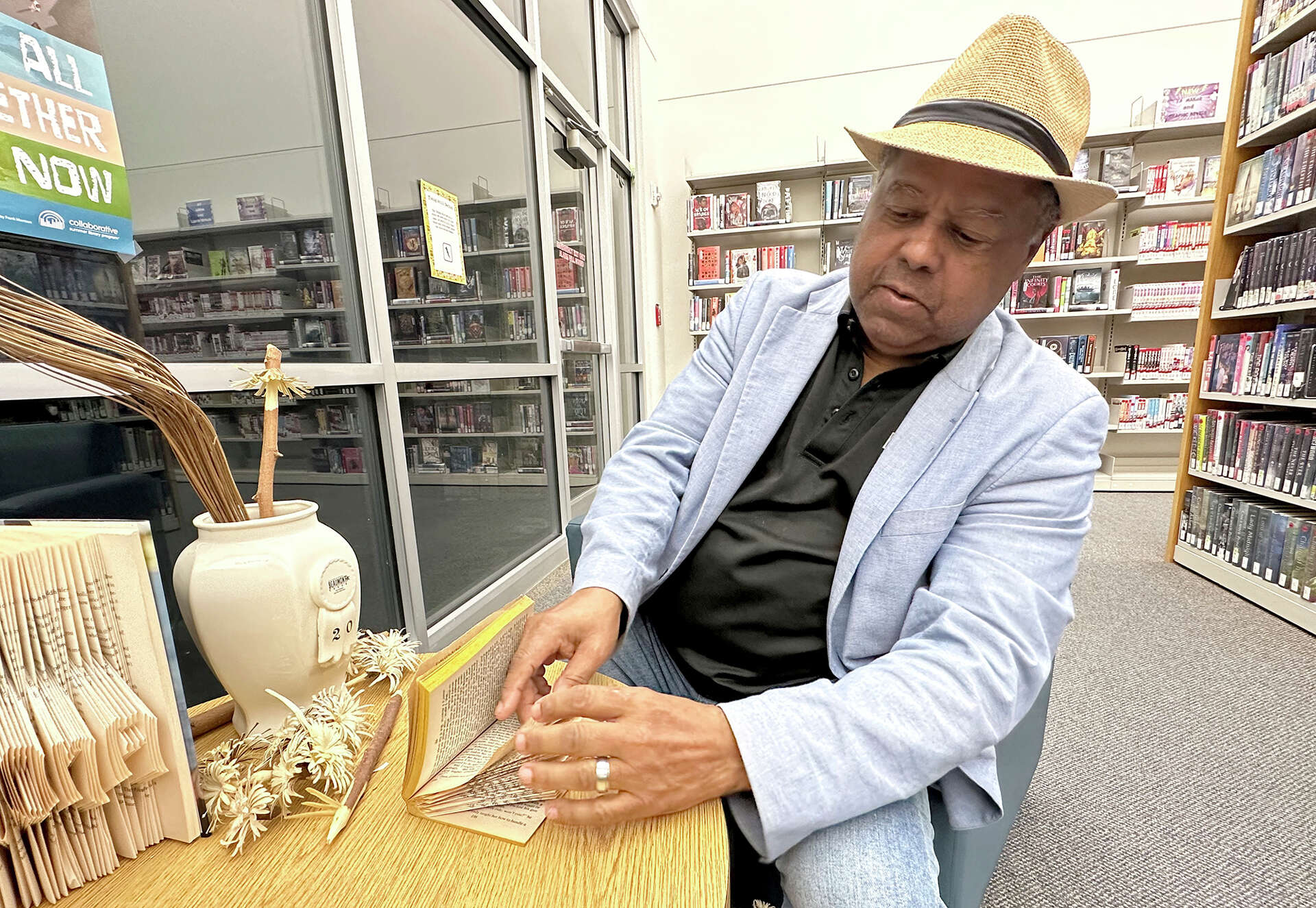 Veteran Herman Davis known for wood carvings turns to book art