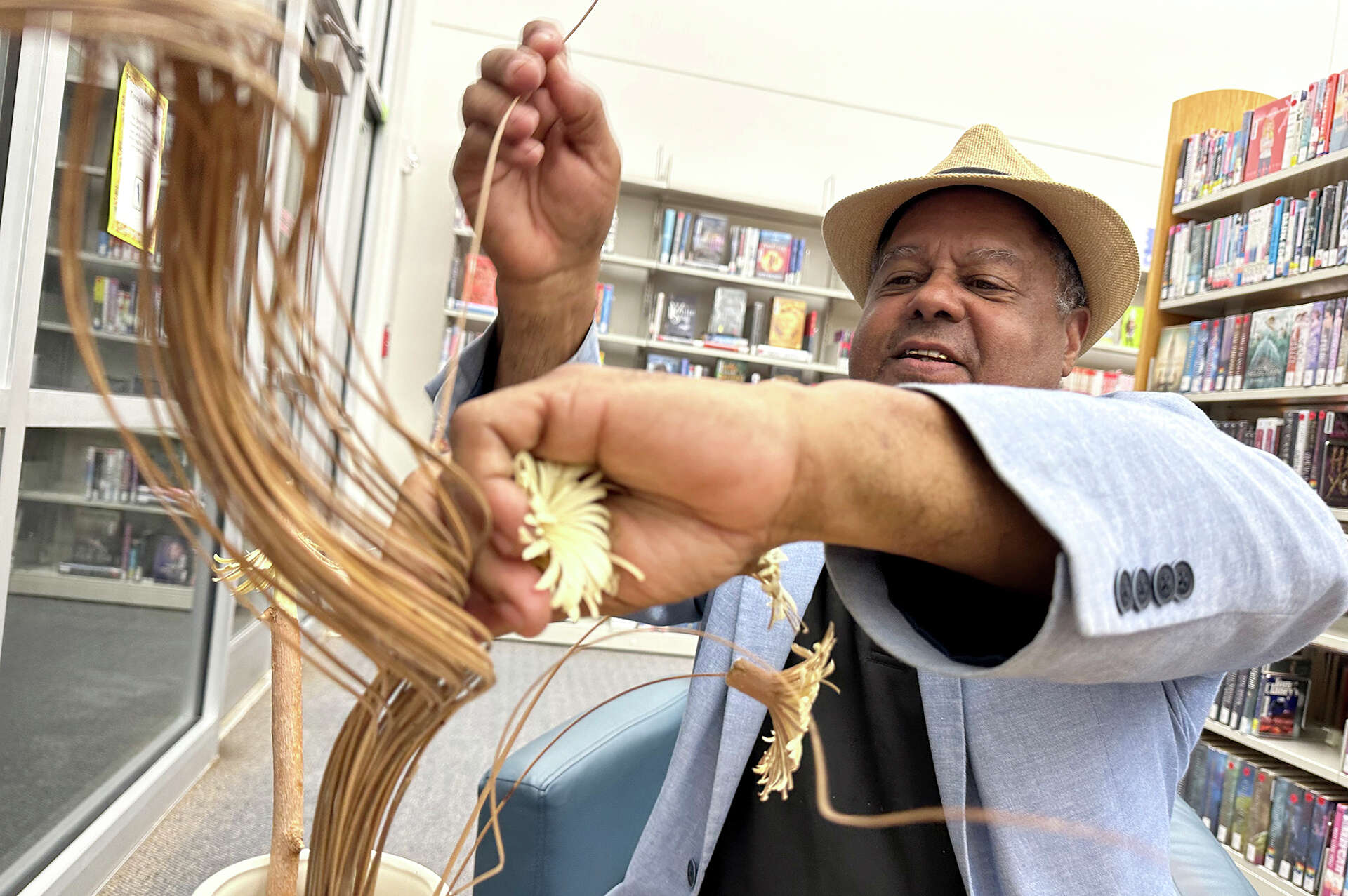 Veteran Herman Davis known for wood carvings turns to book art