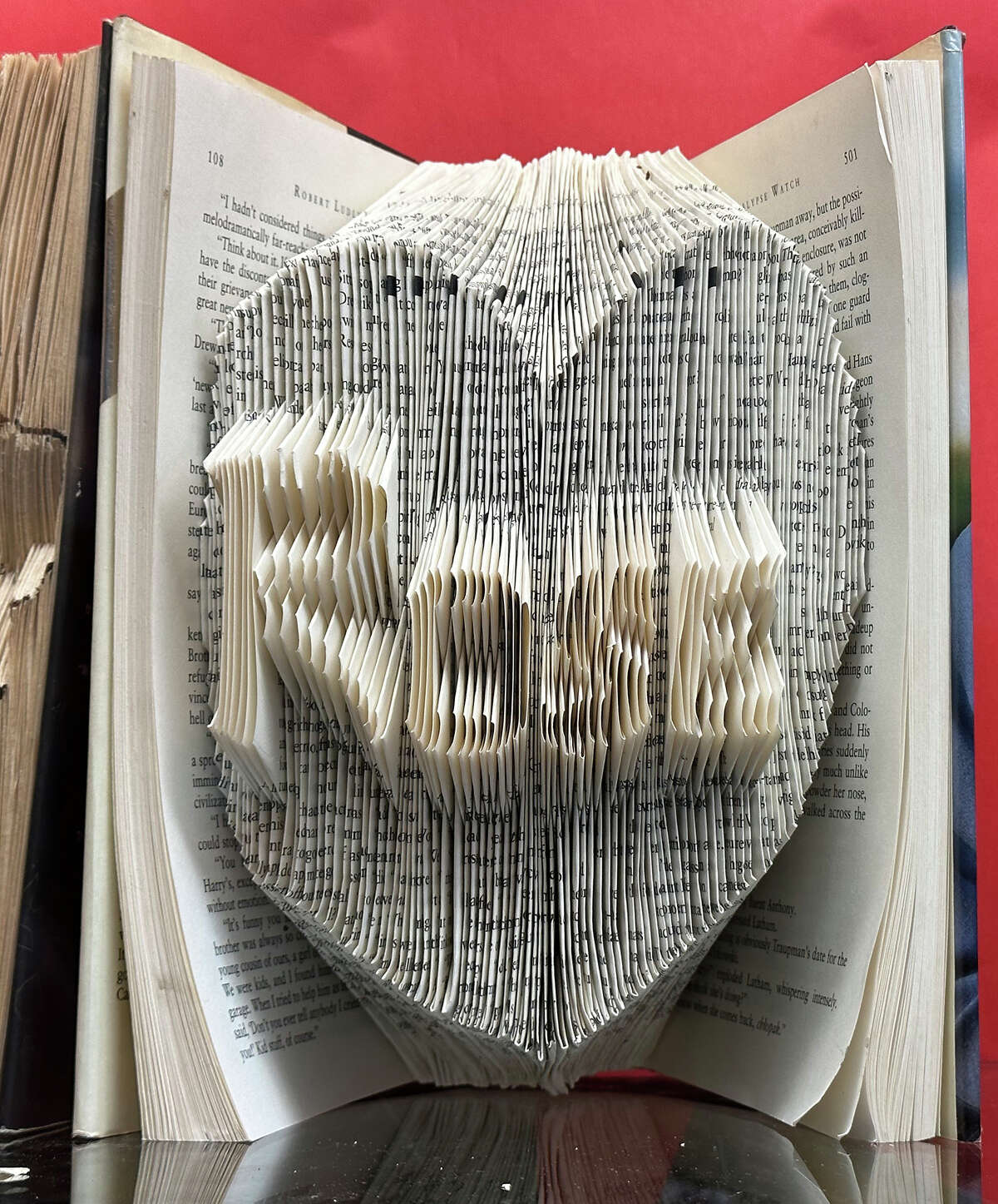Veteran Herman Davis known for wood carvings turns to book art