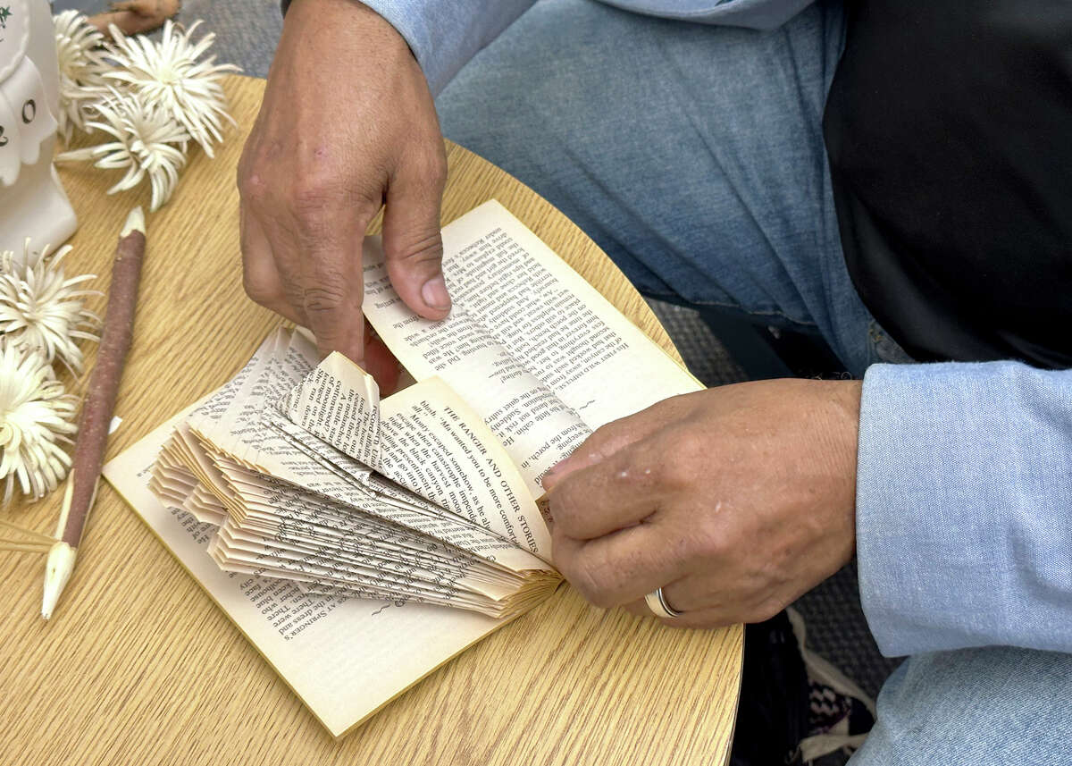 Veteran Herman Davis known for wood carvings turns to book art