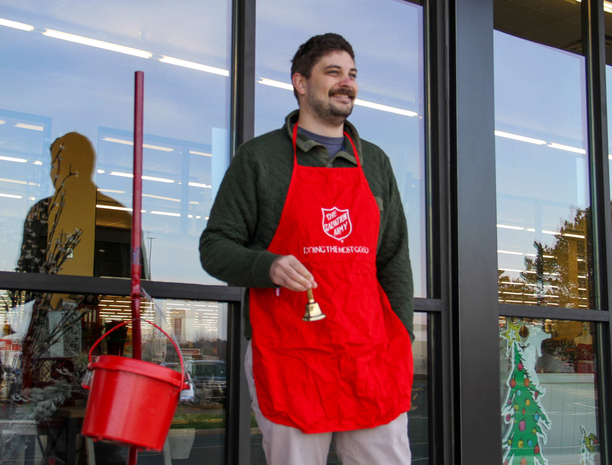 On the job: Max Milne rings in the season of giving